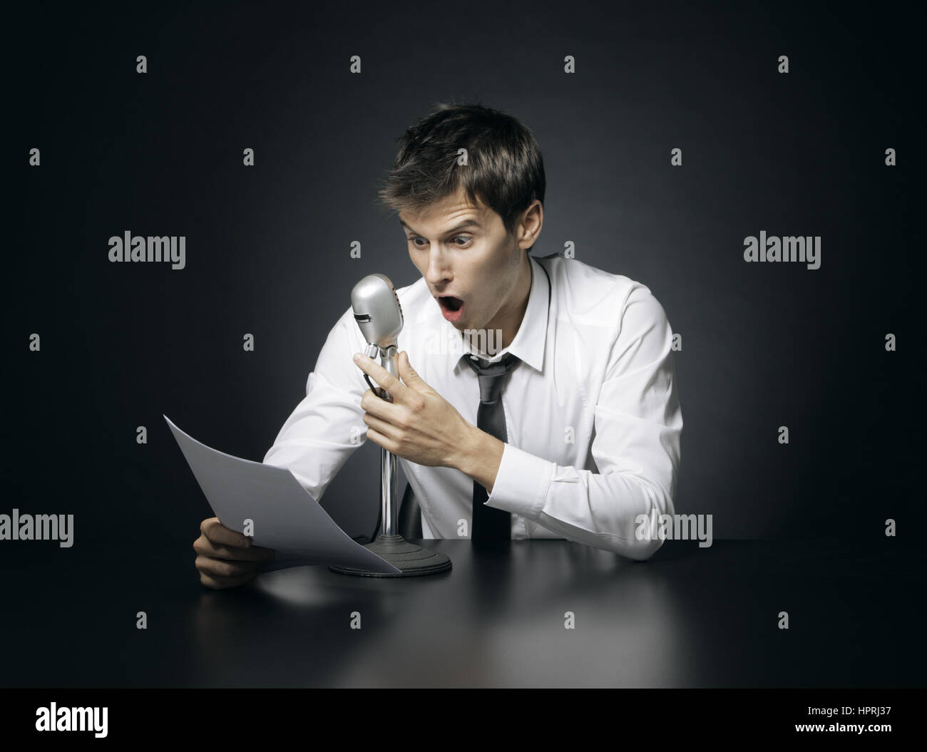 Anchorman screams crazy news Stock Photo - Alamy