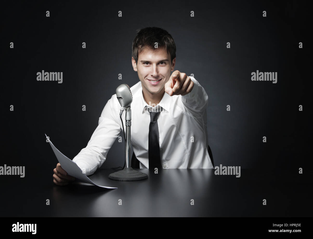 Anchorman smiling pointing at you Stock Photo - Alamy