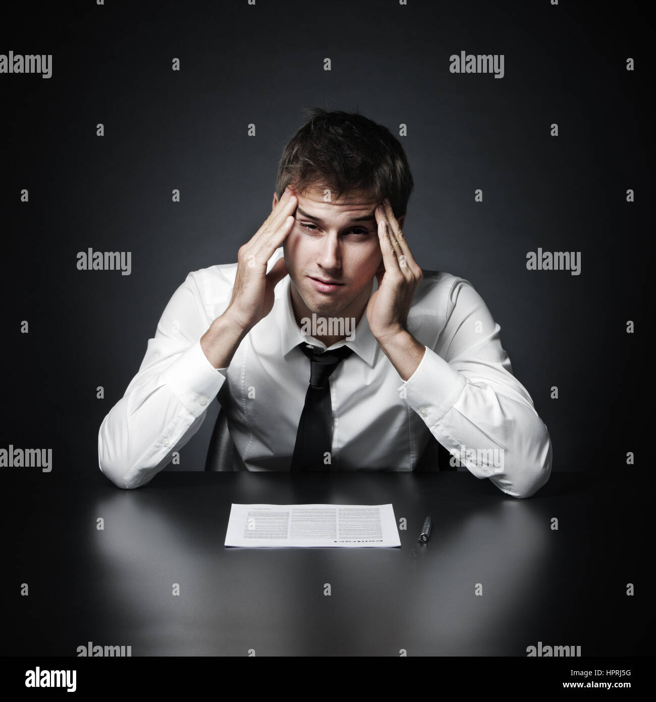 Young businessman has the headache Stock Photo - Alamy