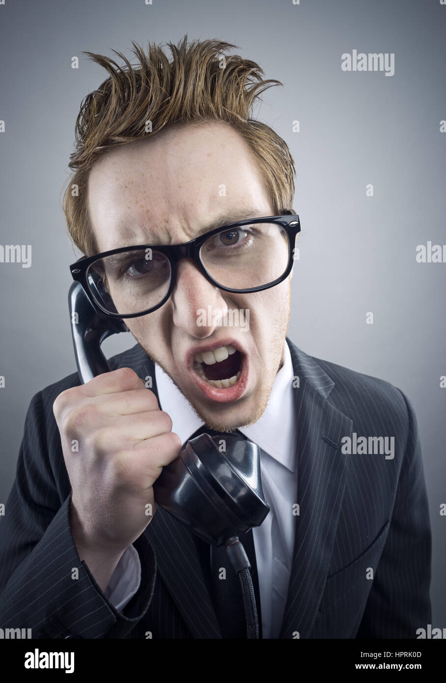 Angry nerd businessman retro telephone hi-res stock photography and ...