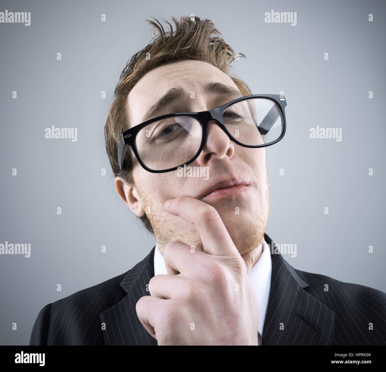 Portrait of young Nerd businessman looking at camera Stock Photo - Alamy