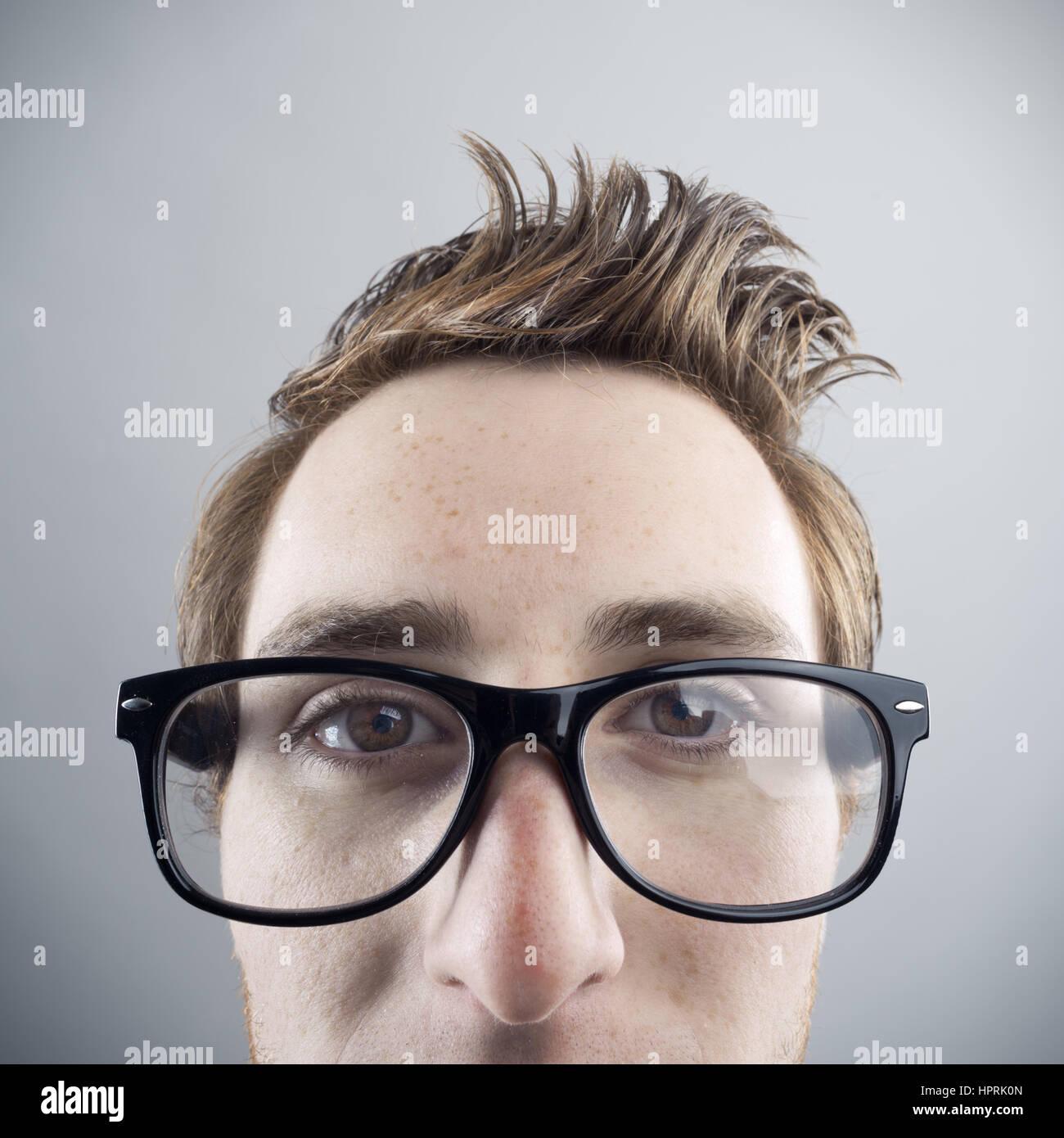 Geek young man looking camera hi-res stock photography and images - Alamy