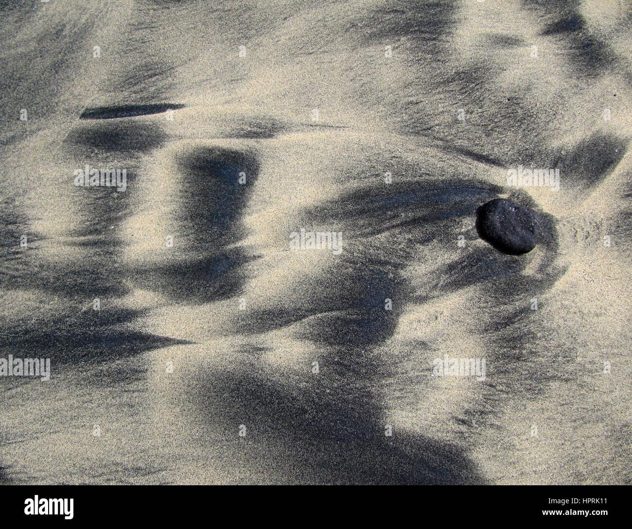 Sand Abstract- Full frame.Patterns in the sand made by retreating tide ...