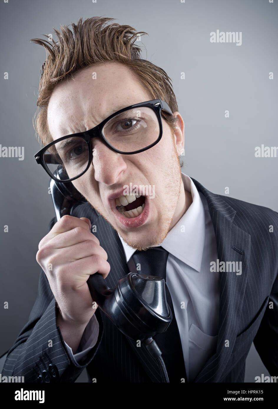 Angry nerd businessman retro telephone hi-res stock photography and ...