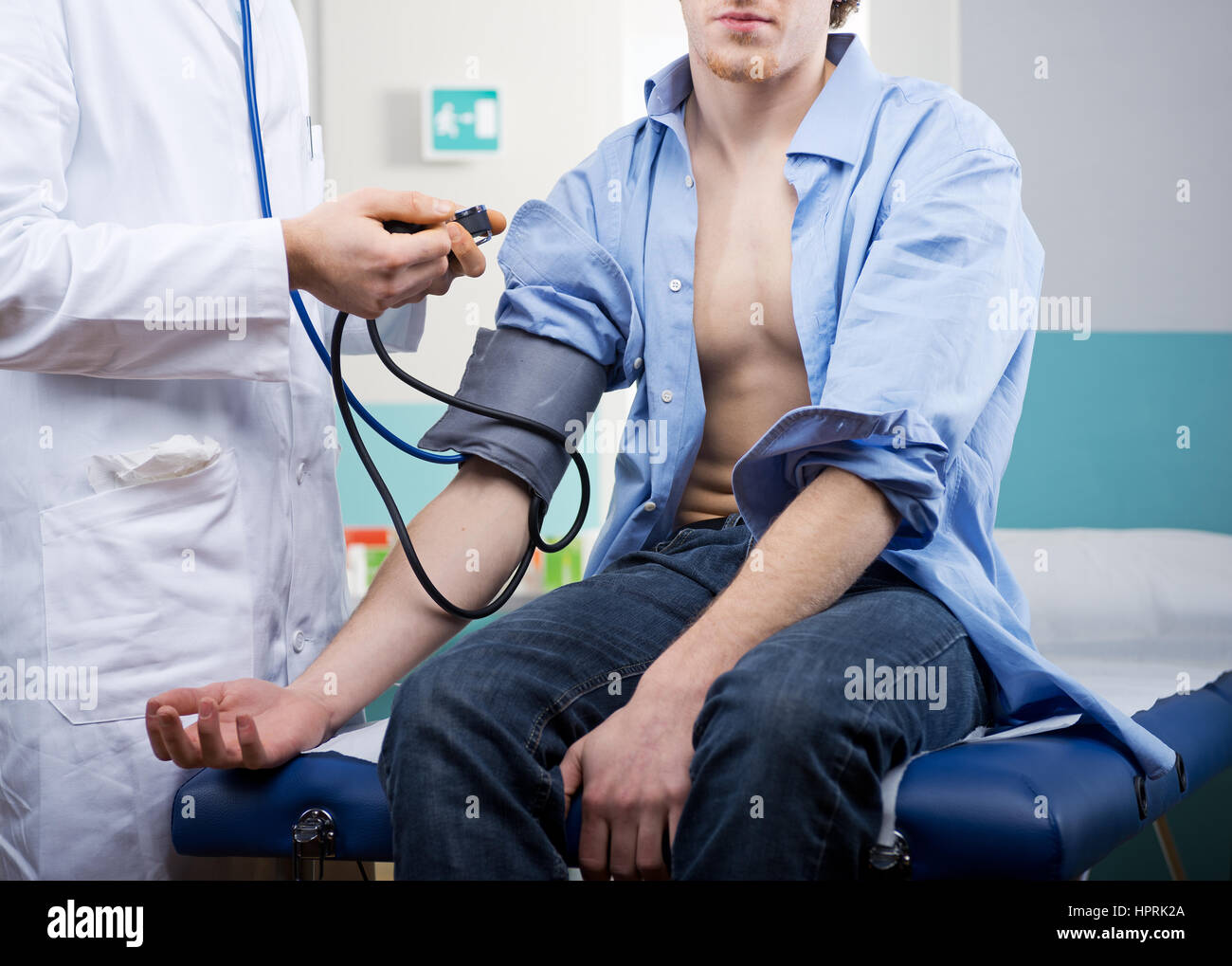 Doctor measuring blood pressure with specific medical equipment Stock ...