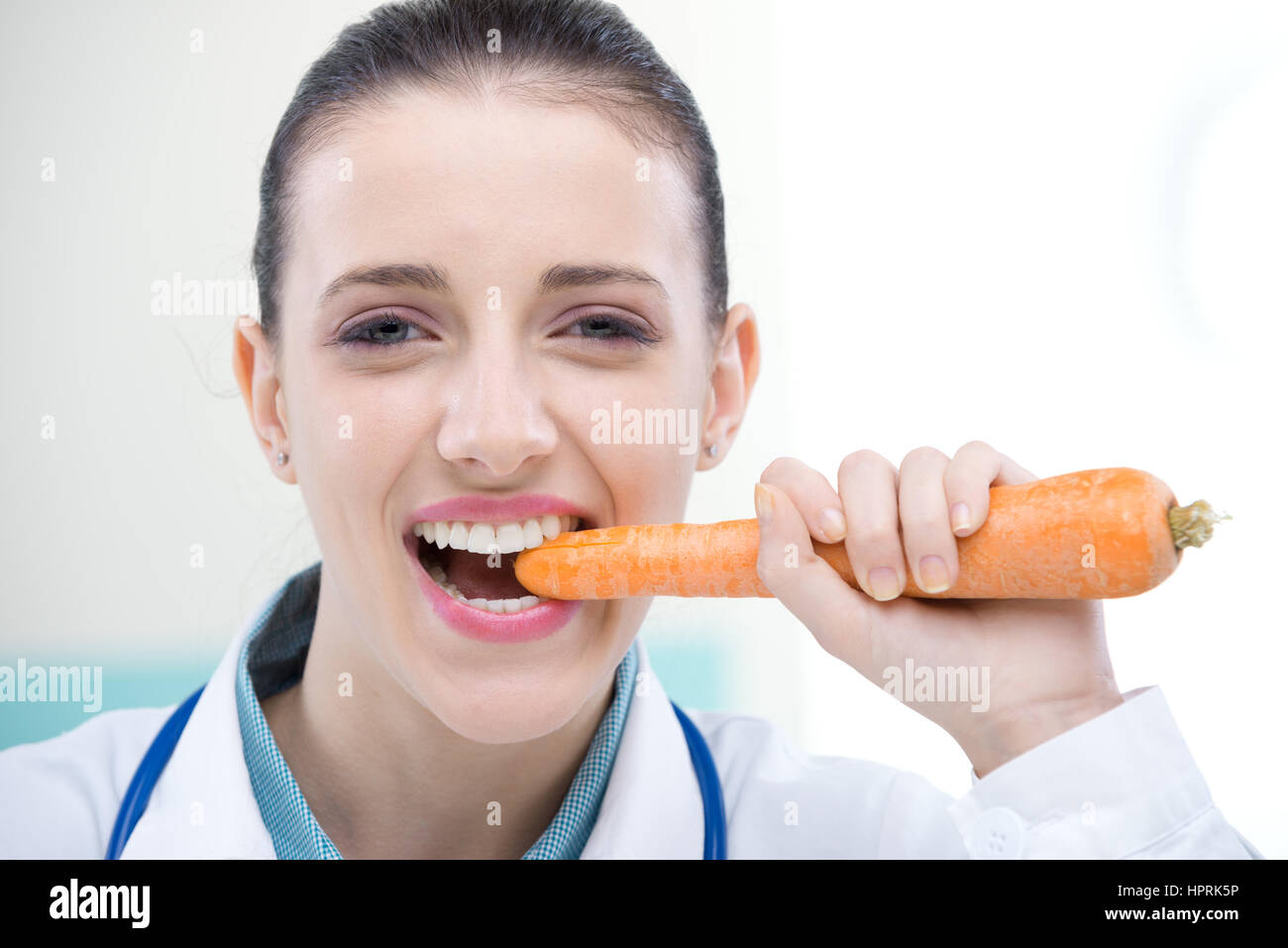 A portrait of cheerful healthcare professional promoting healthy eating ...