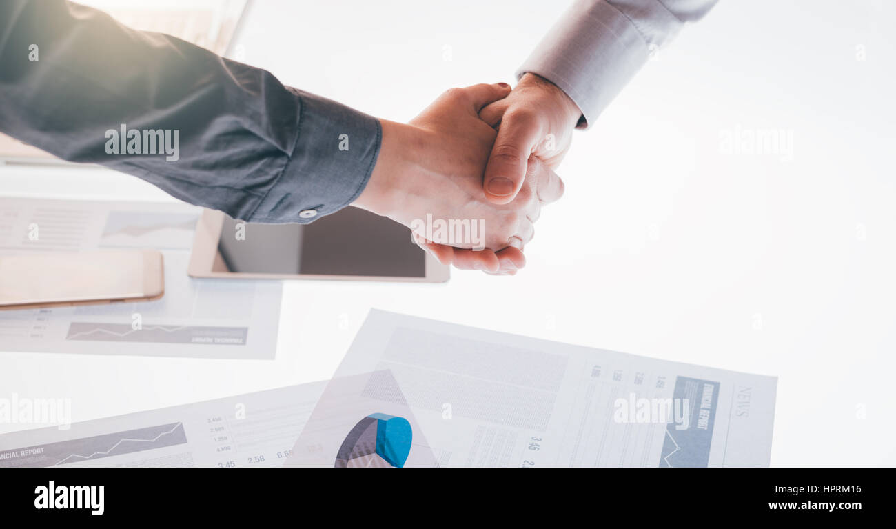 Business people having a meeting and handshaking, hands close up ...