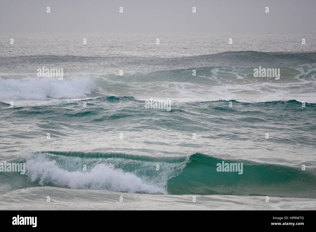 Stormy misty ocean with waves breaking in all directions Stock Photo ...