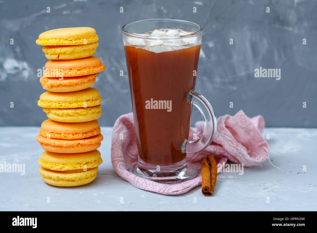Homemade lemon and apricot macaroons and hot cocoa on a concrete ...