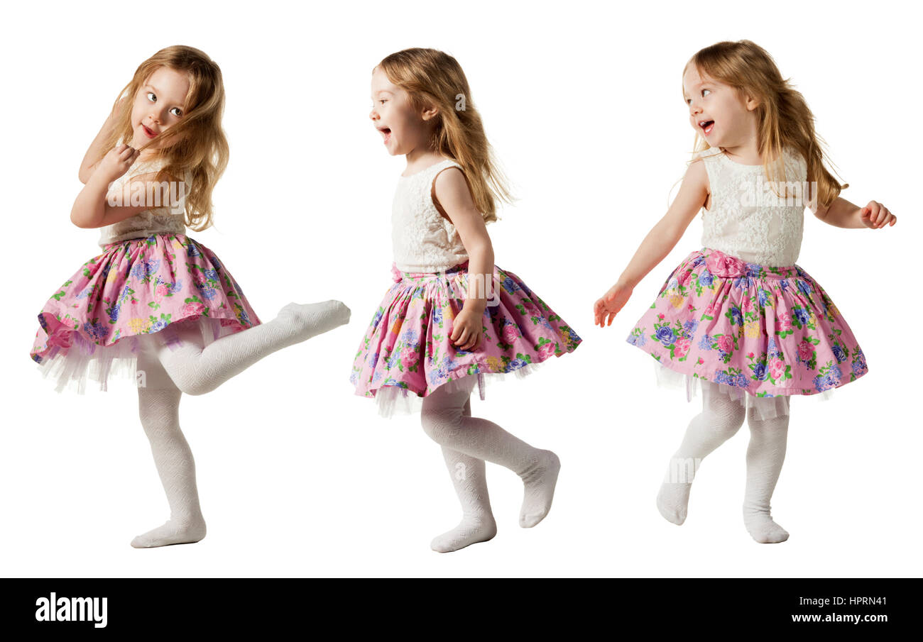 Cute three-year girl is jumping, running, dancing, laughing. Her hair ...