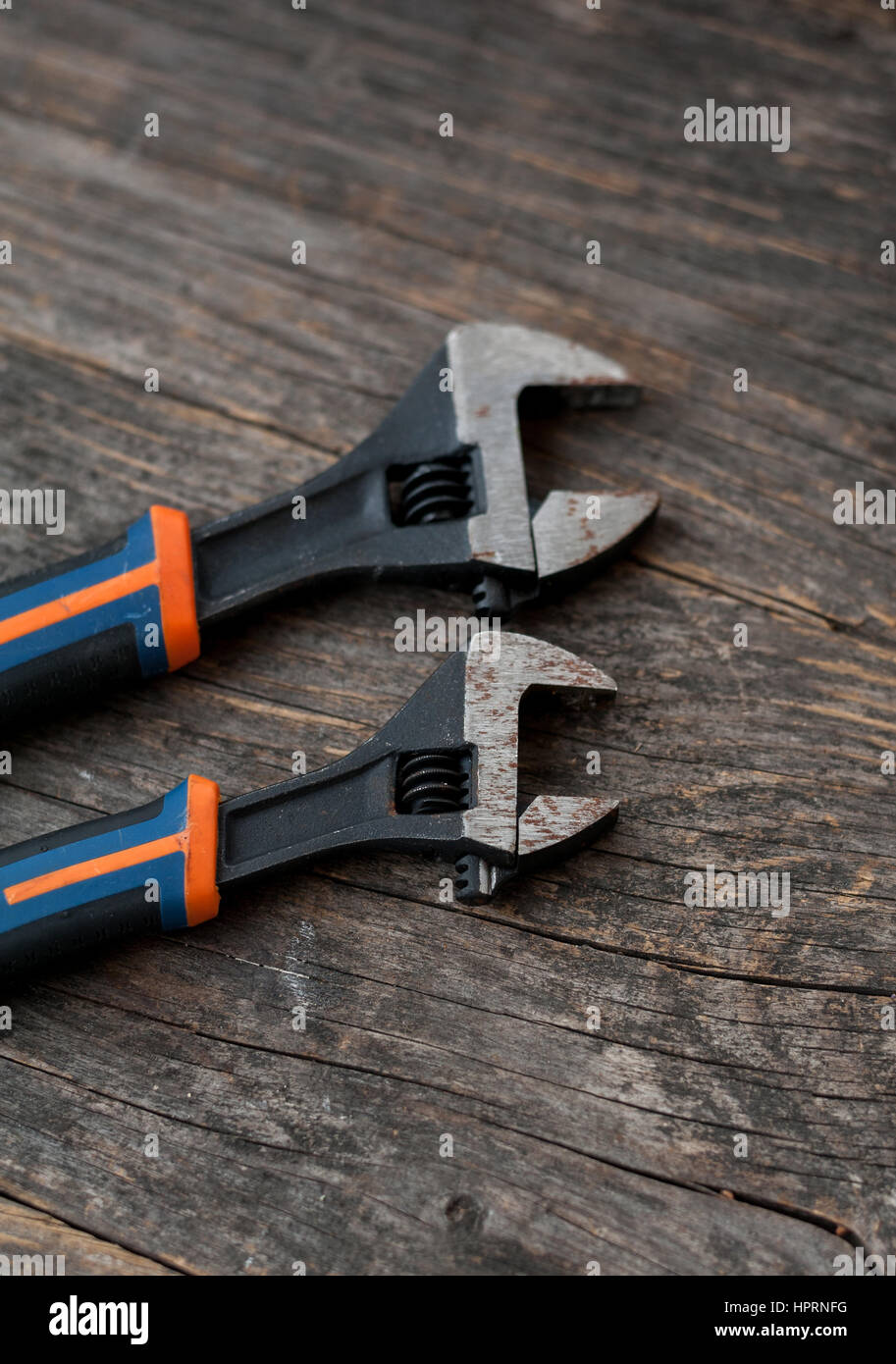 Two wrenches on a wooden background Stock Photo - Alamy