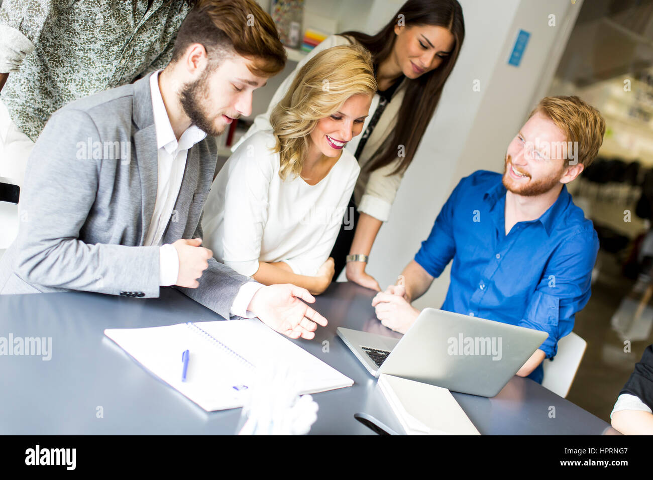 Young people working in the office Stock Photo - Alamy