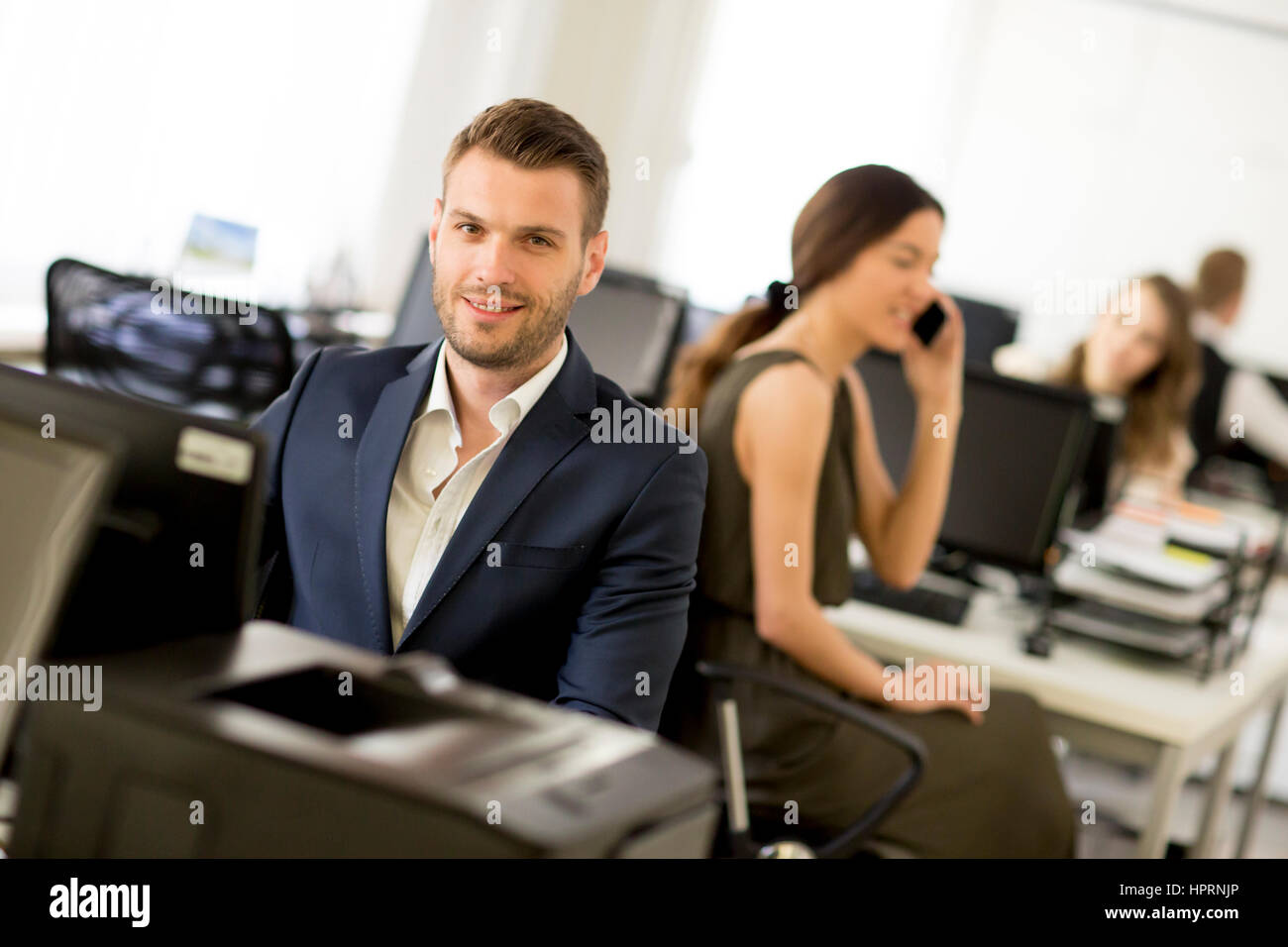 Young people working in the modern office Stock Photo - Alamy