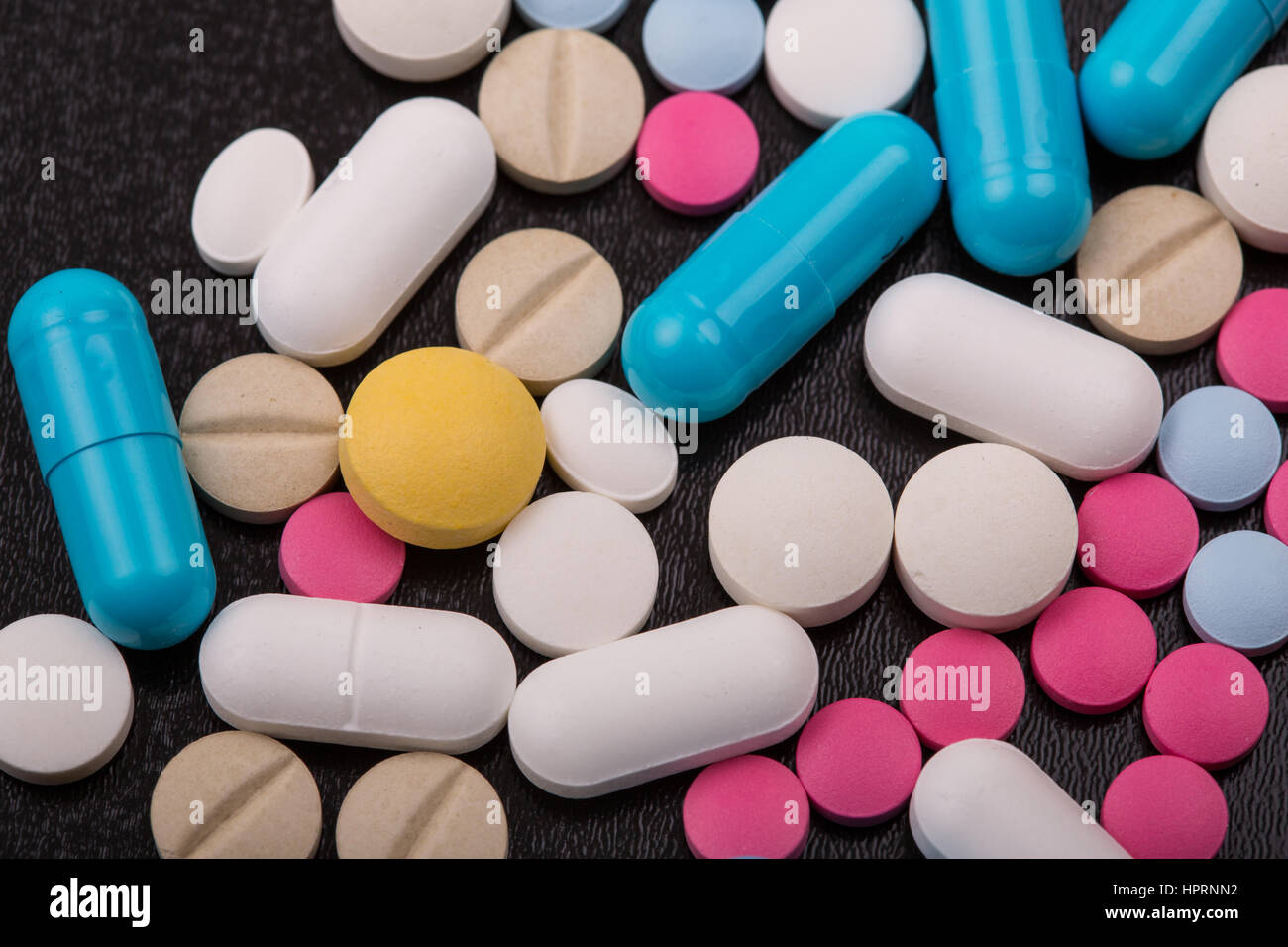 different tablets pills capsule heap mix therapy drugs Stock Photo - Alamy