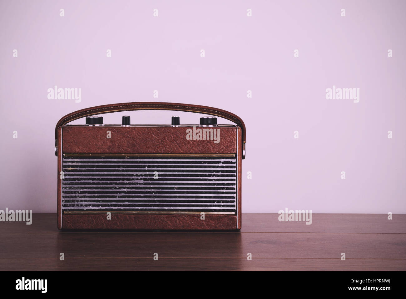 Old retro style radio on a wooden surface with light background Vintage ...