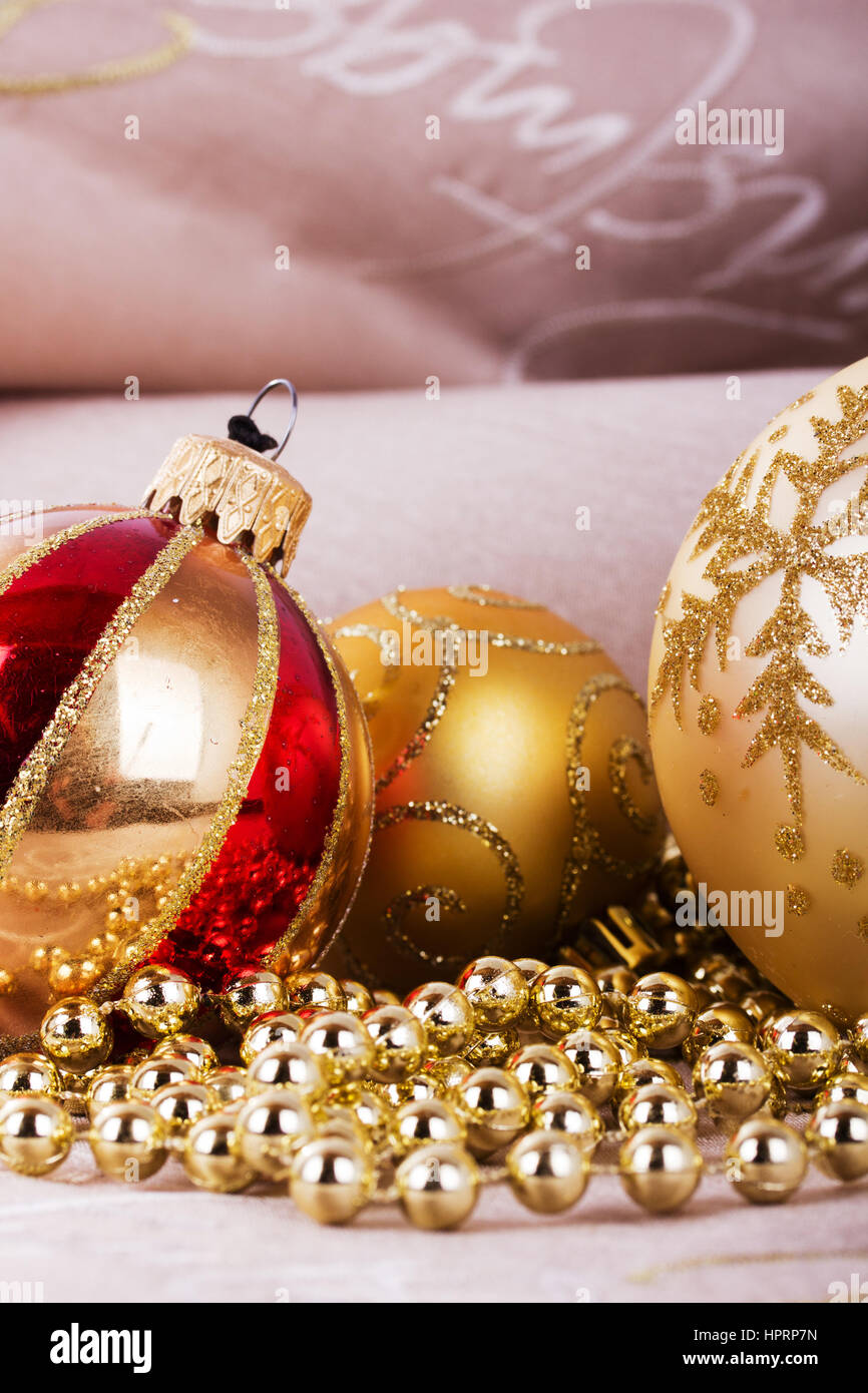 Festive gold Christmas decorations on a fabric background Stock Photo ...