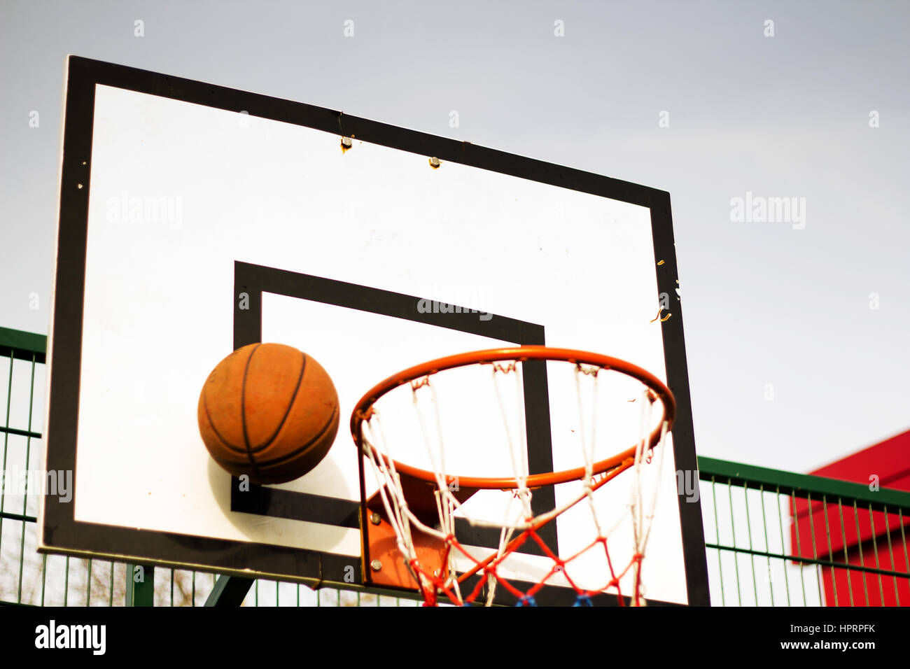 Basketball hoop outside in a school play area Stock Photo - Alamy