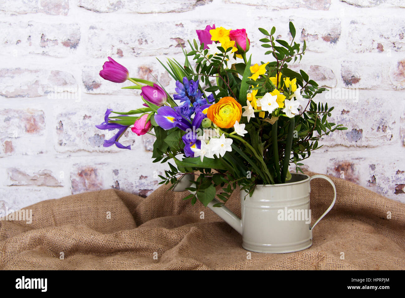 Spring cut flower arrangement against a rustic background Stock Photo ...