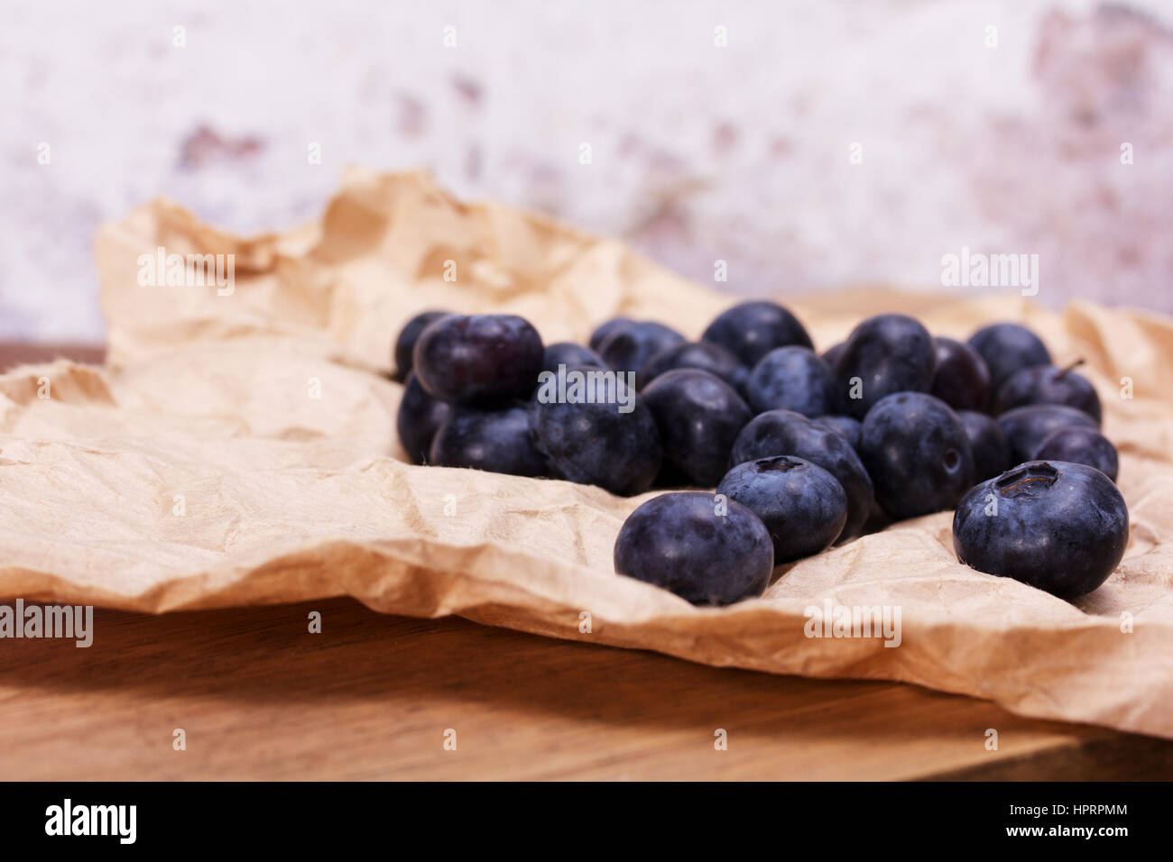 Fresh blueberries on a rustic paper background Stock Photo - Alamy