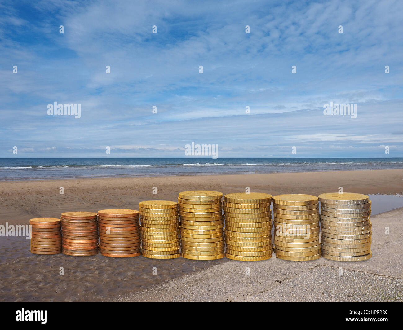 Piles of money on the shore by the sea Stock Photo - Alamy