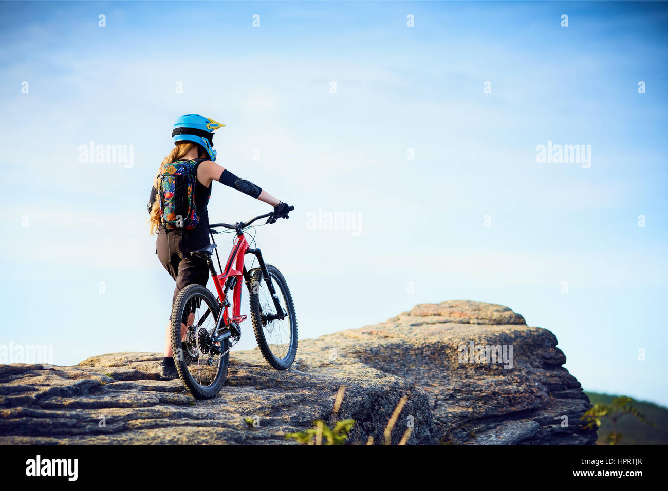 Female MTB mountain biker enjoys the view during cycling trip Stock ...