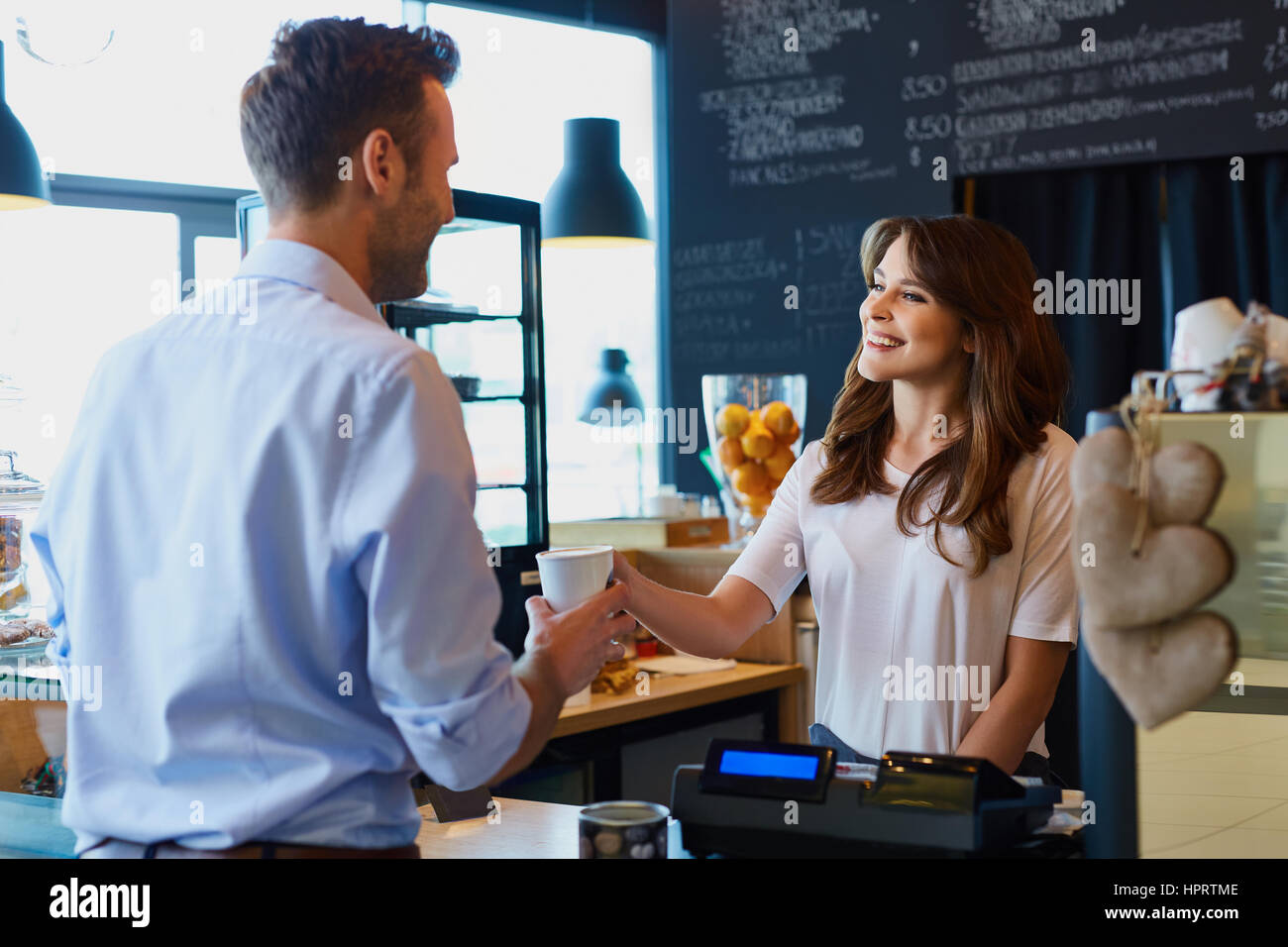 Man serving cafe hi-res stock photography and images - Alamy