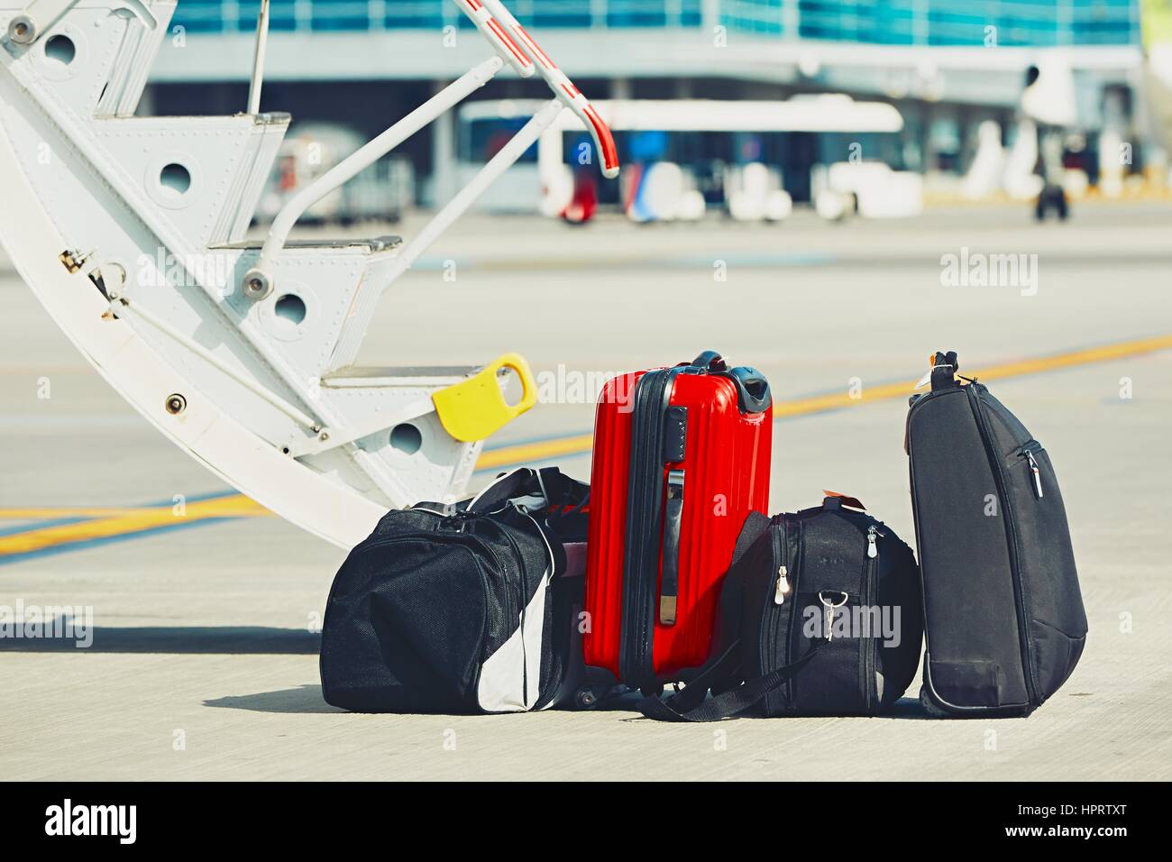 Travel luggage are ready for loading to the airplane at the airport ...