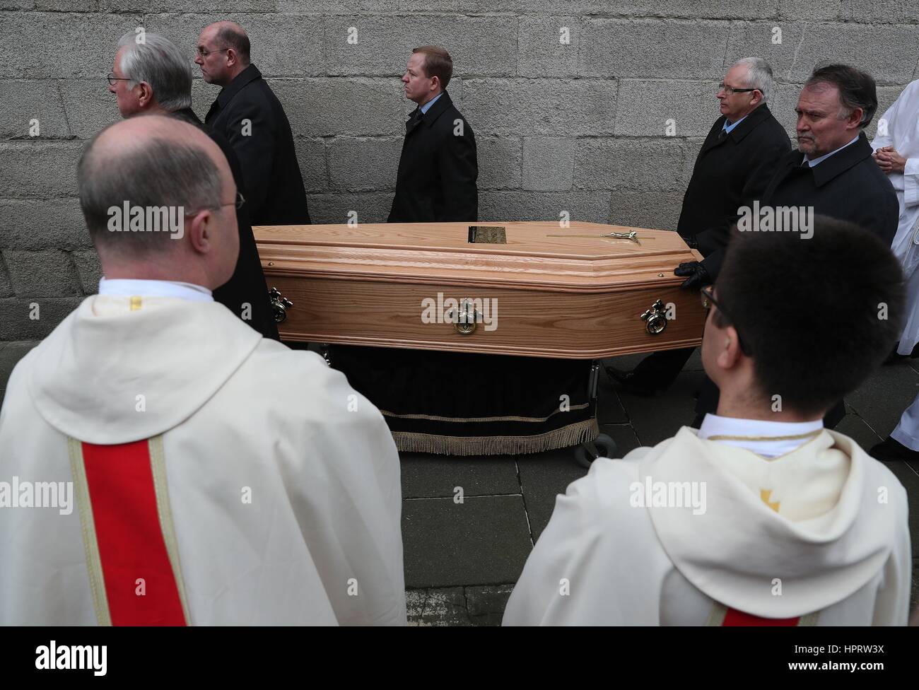The coffin is brought from the cathedral following the funeral mass of ...
