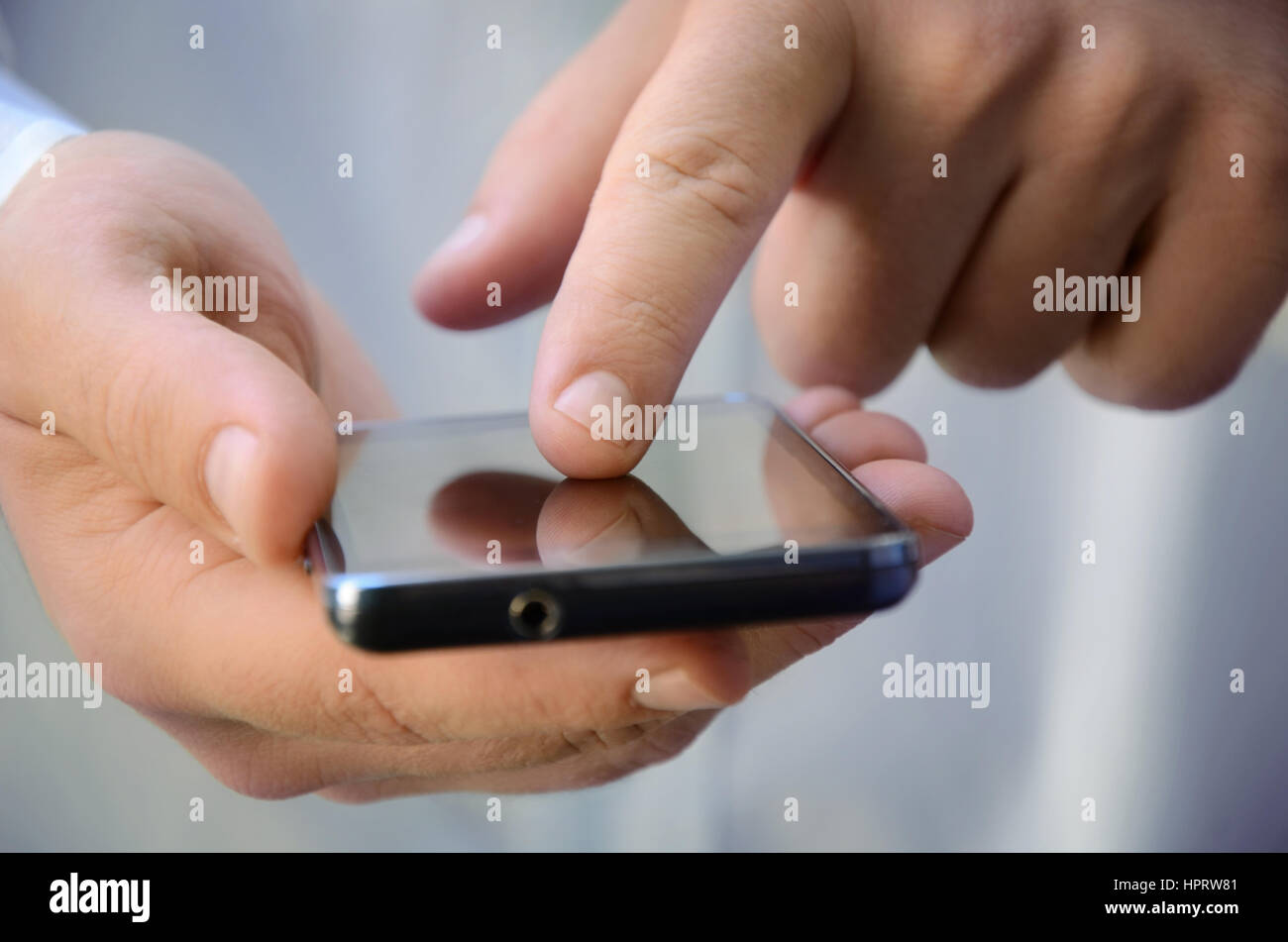 Male's hands use a smartphone Stock Photo - Alamy