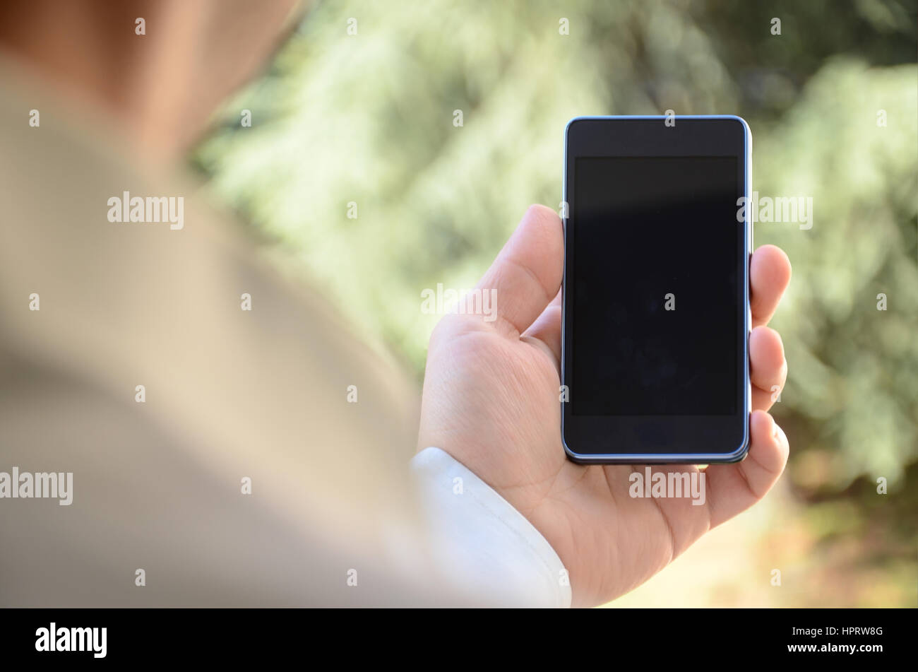 Man showing smart phone with isolated screen in hand Stock Photo - Alamy