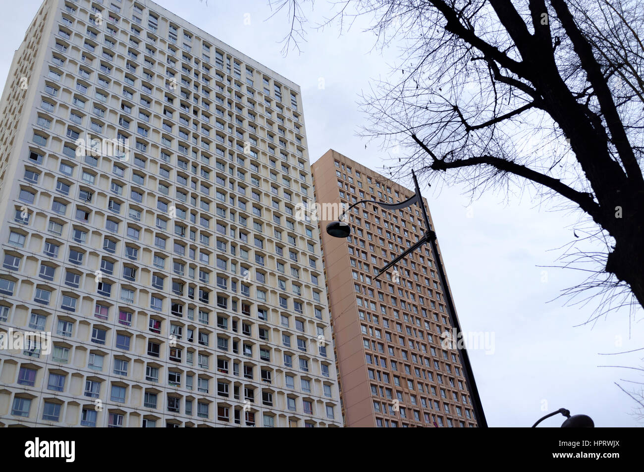 Looking up at the facades of two high-rise buildings in Paris with a ...