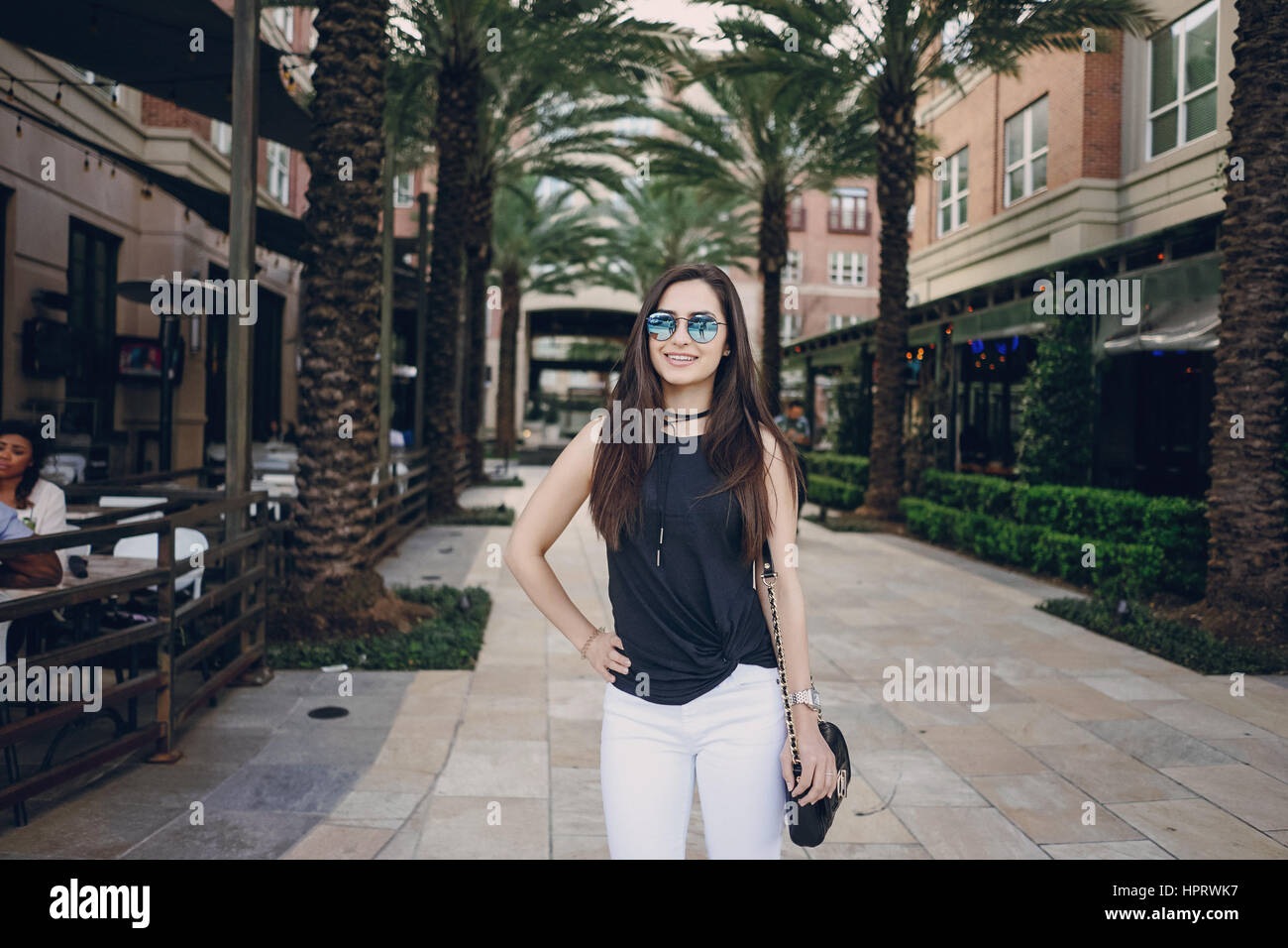 beautiful young girl enjoying the warm weather Stock Photo - Alamy