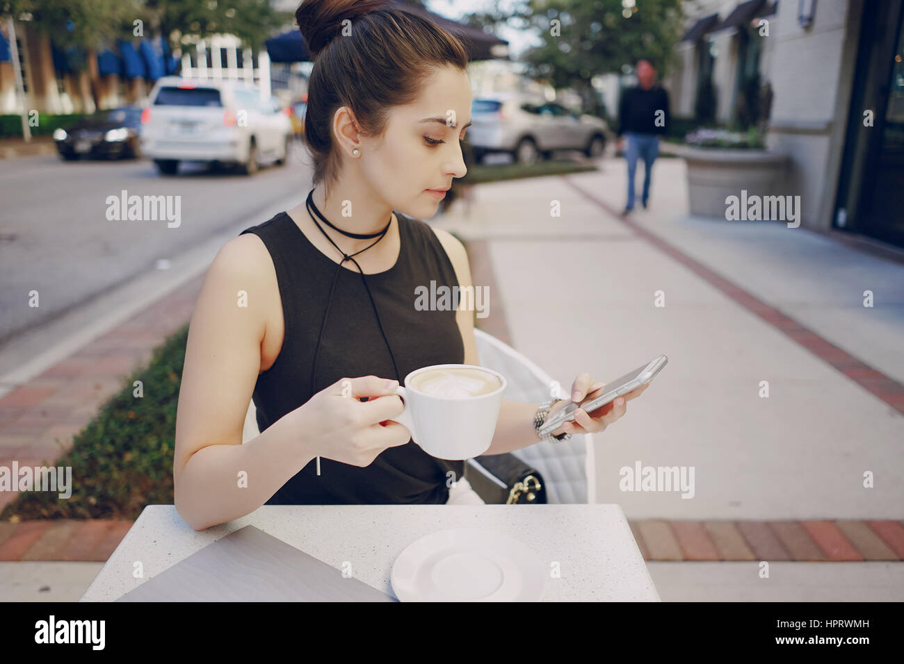 beautiful young girl is typing on phone Stock Photo - Alamy