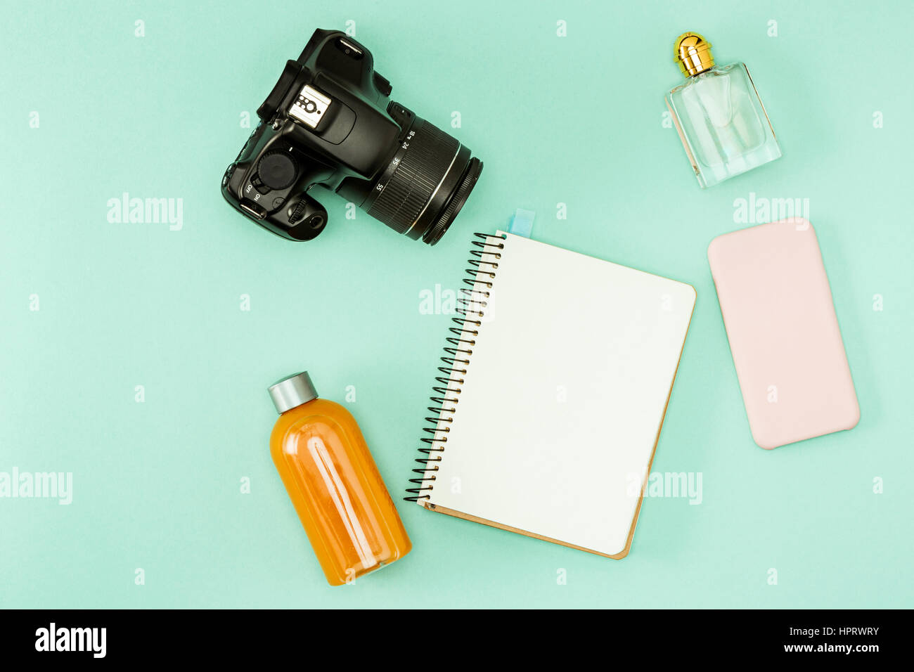 The female personal items on desktop on blue Stock Photo - Alamy