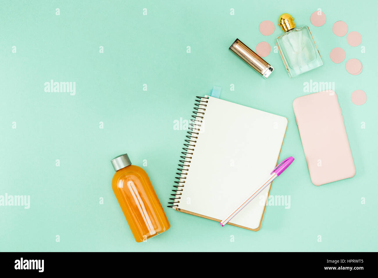 The female personal items on desktop on blue Stock Photo - Alamy