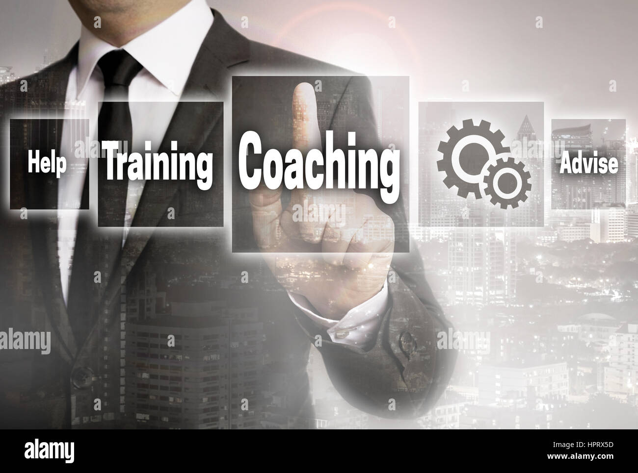 Coaching businessman with city background concept Stock Photo - Alamy