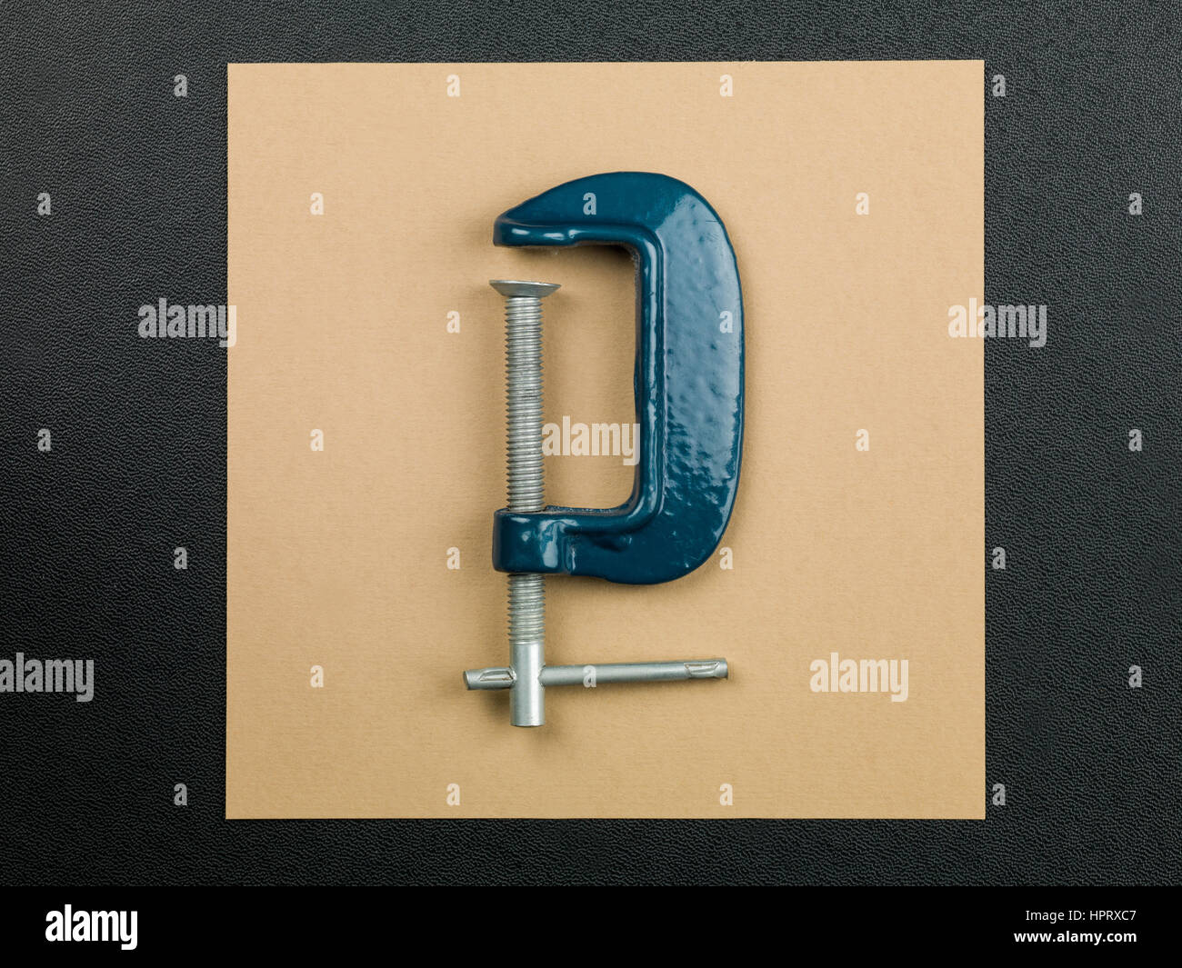 Workers or Craftsman G-Clamp Tool Against a Black Background Stock ...