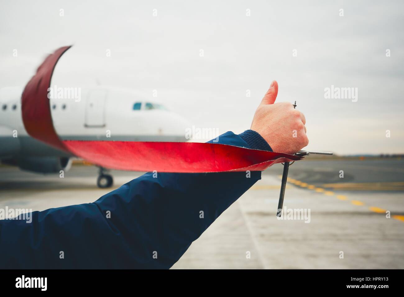 Member of ground crew is showing OK sign to pilot before take off Stock ...