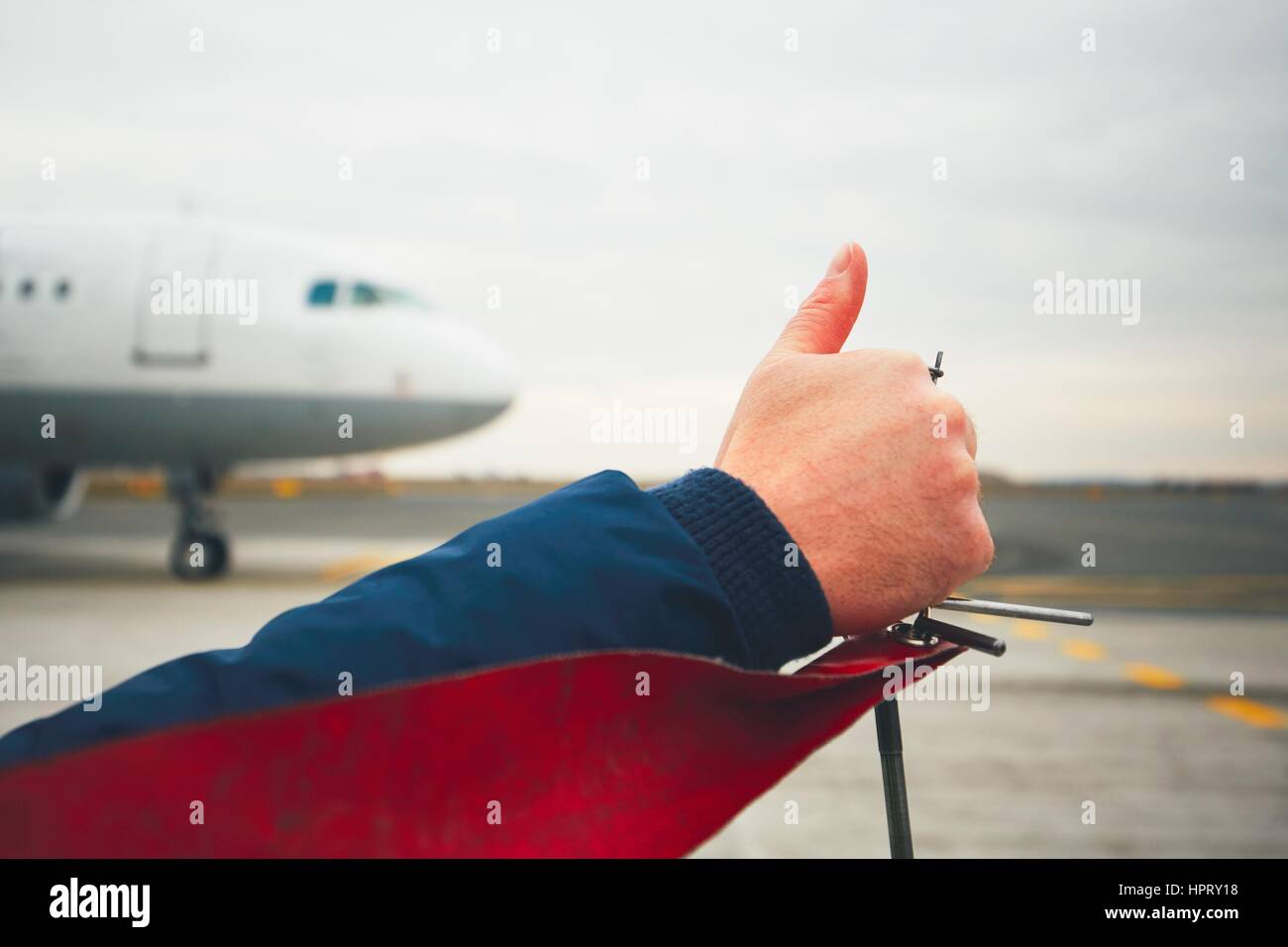 Member of ground crew is showing OK sign to pilot before take off Stock ...