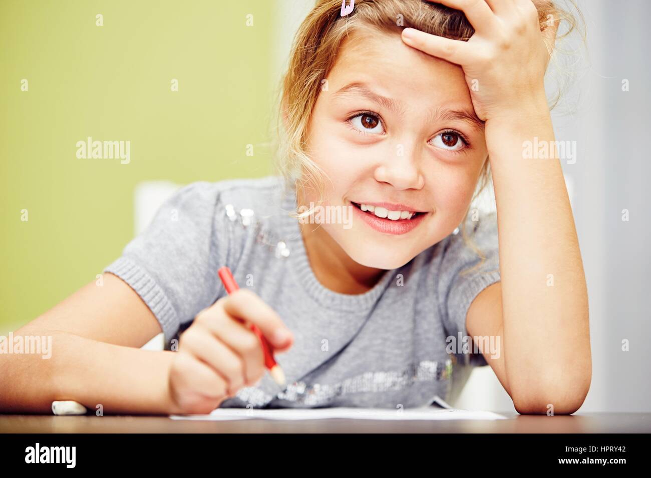 Little girl is doing his homework for elementary school Stock Photo - Alamy