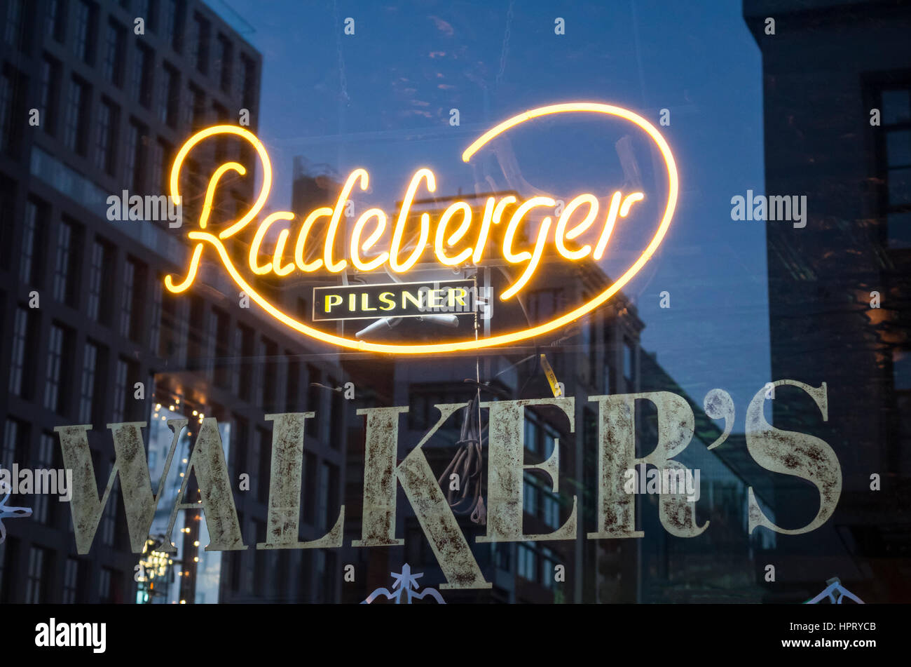 Neon sign for Radeberger German pilsner in a pub window Stock Photo - Alamy
