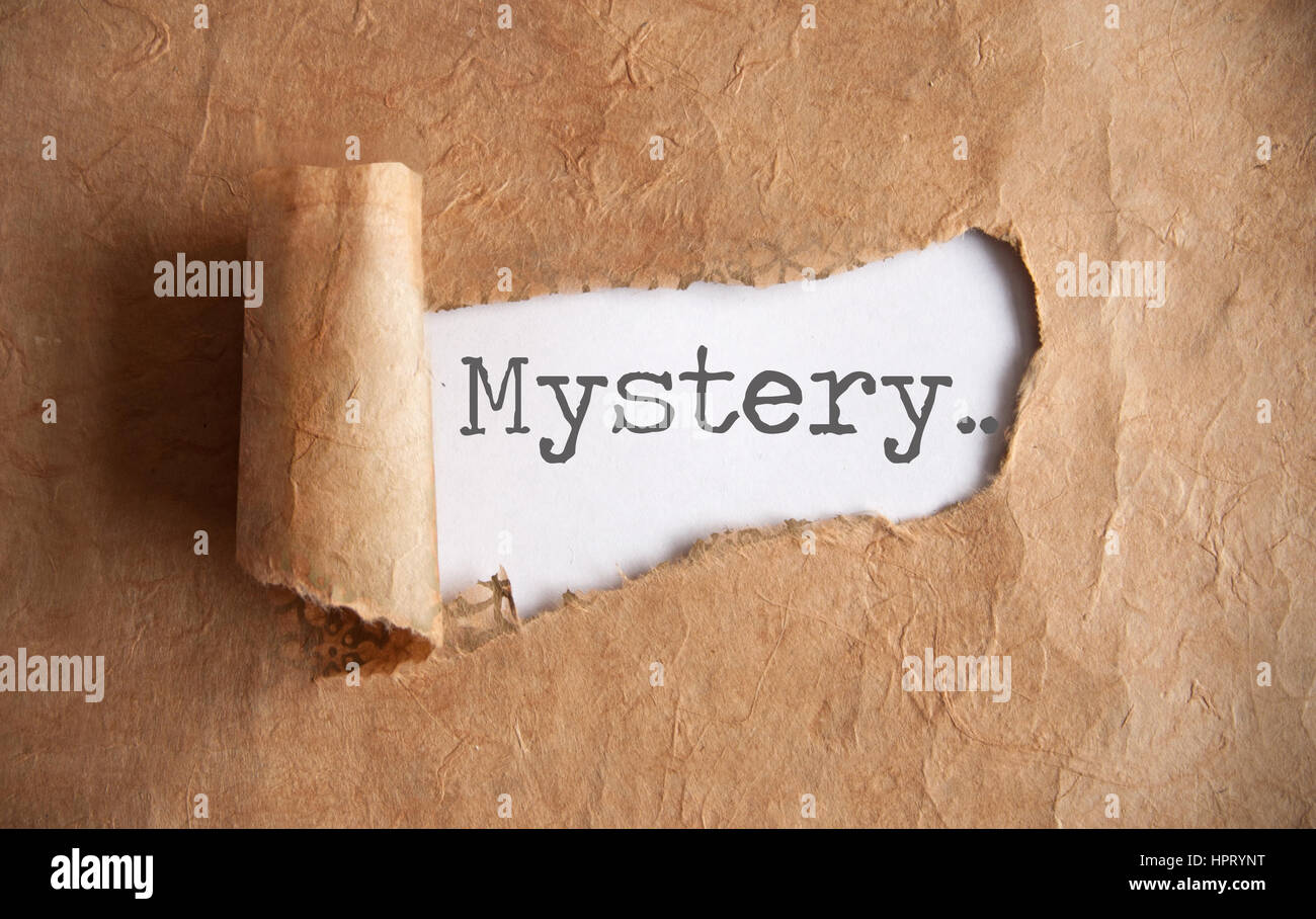Torn piece of scroll uncovering mystery Stock Photo - Alamy