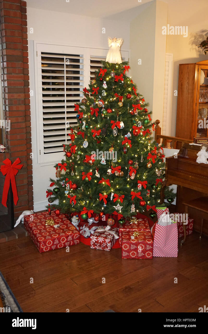 Christmas Tree with Red Ribbons Stock Photo - Alamy