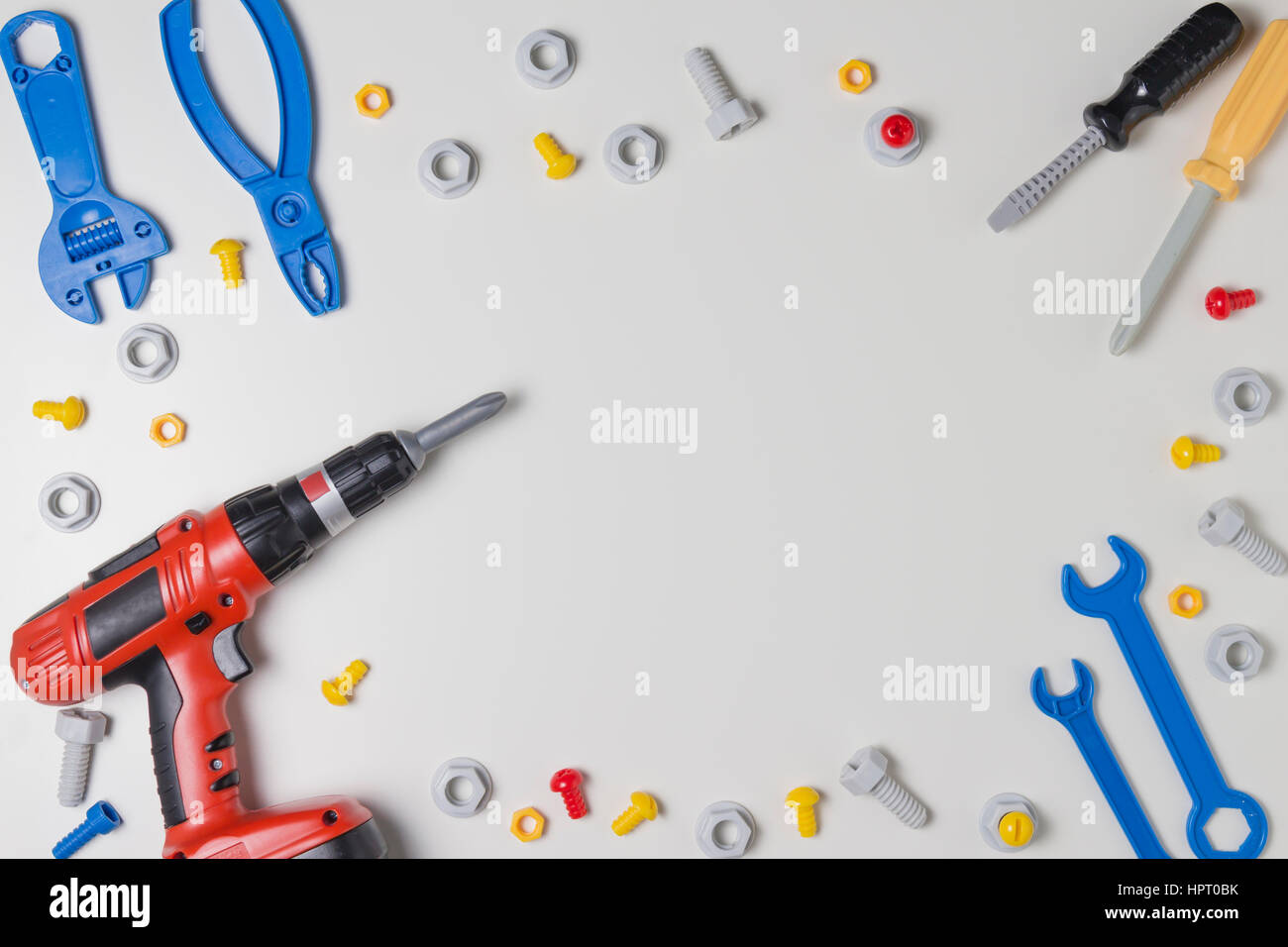 Toys tools as border frame on white background. Top view. Copy space ...