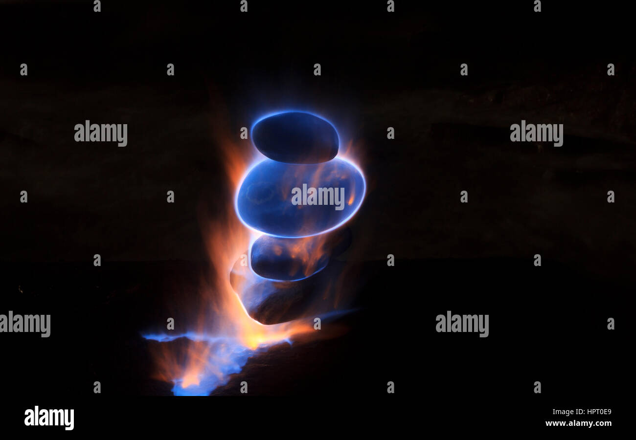 Equilibrium of rocks and fire Stock Photo - Alamy