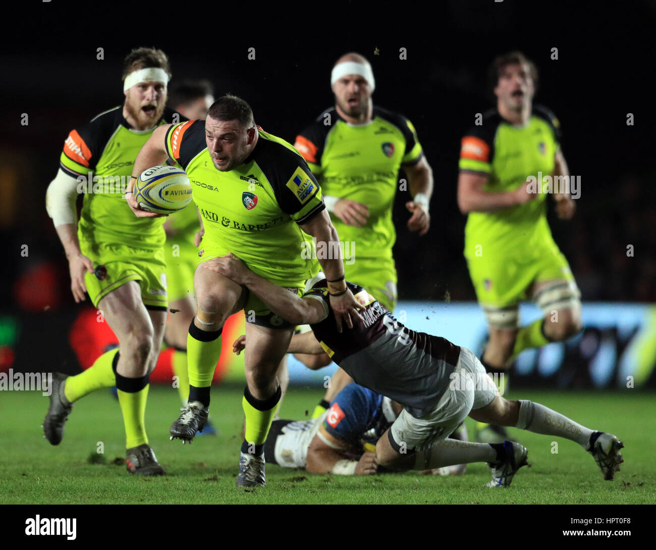 Harlequins' Charlie Mulchrone stops Leicester's Greg Bateman during the ...