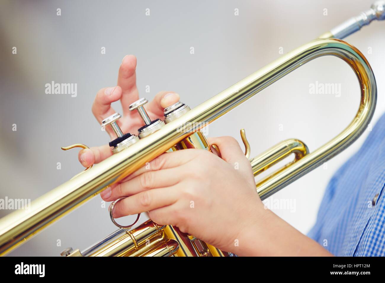 Little boy is playing the trumpet at home Stock Photo - Alamy