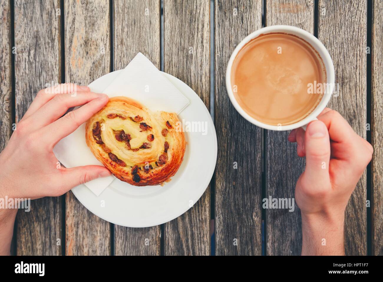 Morning coffee with with sweet pastries. Breakfast of the young man ...