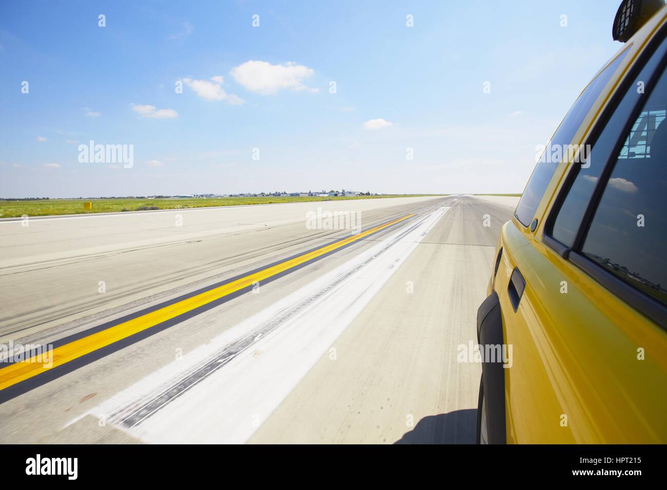 Airfield - safety car on the runway - blurred motion Stock Photo - Alamy