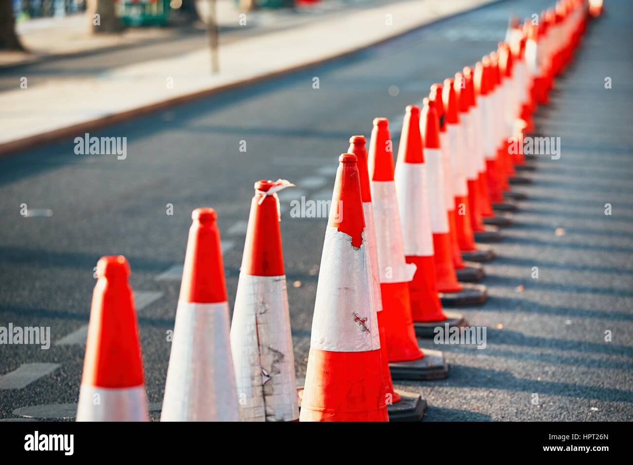 Road work. Orange traffic cones in the middle of the street Stock Photo ...